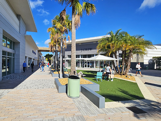 Palm trees and outdoor seating areas remind you that bargain hunting in Florida beats bundling up in mall parking lots.