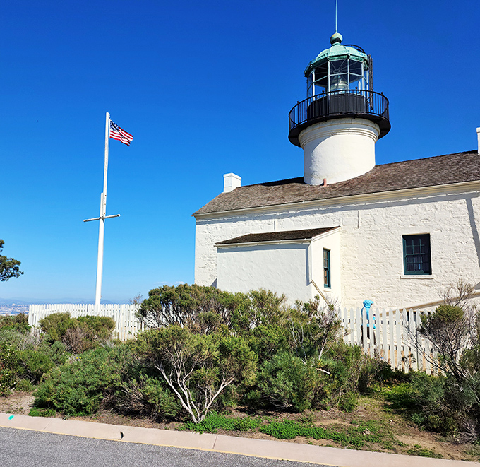 The American flag snaps smartly in the ocean breeze, providing the perfect patriotic accent to this historic maritime landmark.