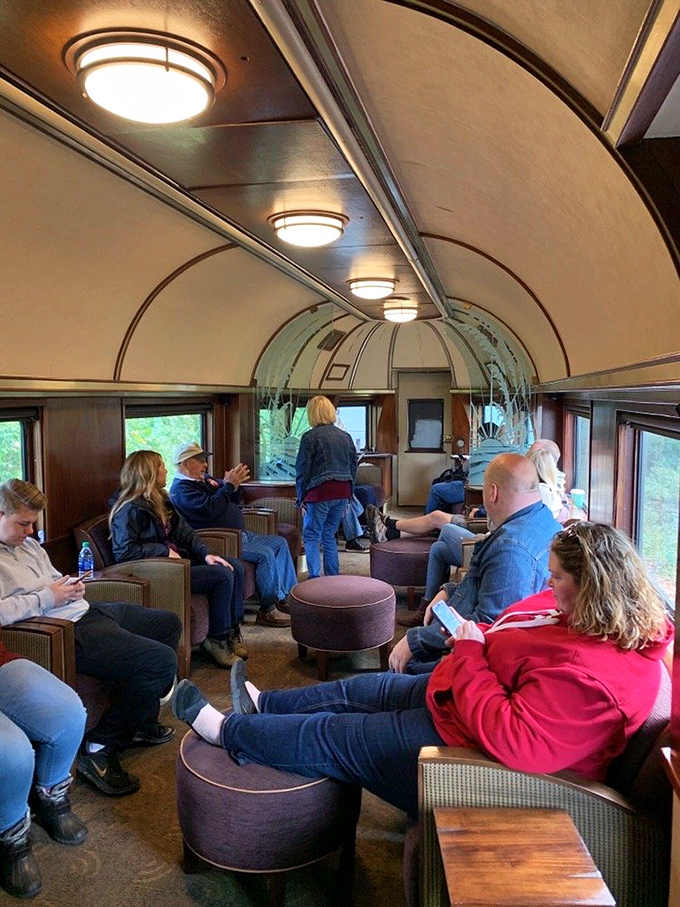 Fellow travelers sharing the universal language of "wow, look at that!" Some glued to windows, others to phones&mdash;documenting memories in real-time.