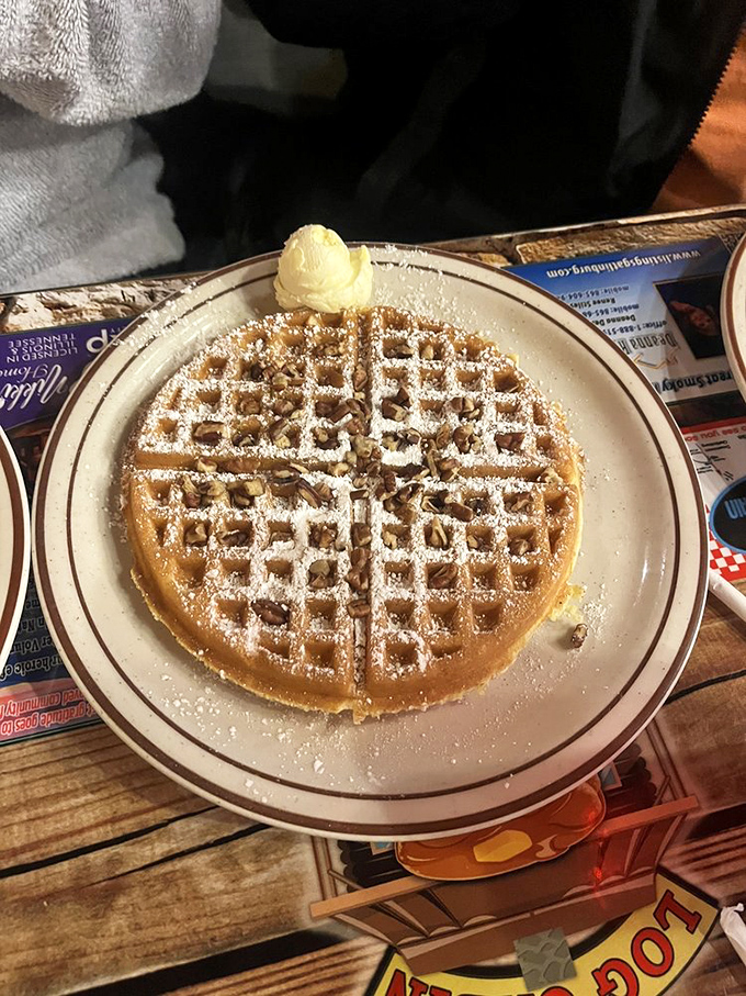 A waffle architecture so perfect it deserves its own blueprint. That scoop of butter melting on top is the cherry on this breakfast sundae.