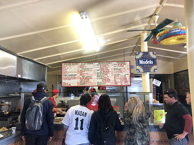 The lunch rush line forms with the precision of a well-rehearsed dance – regulars know the drill and newcomers quickly learn the choreography.
