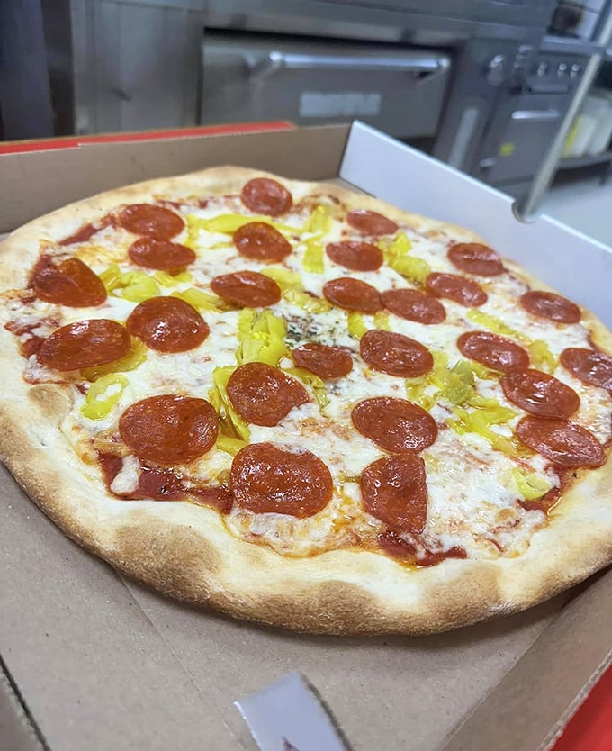 Those pepperoni cups—little pools of spicy oil that transform an ordinary pizza into something worth driving across county lines for.