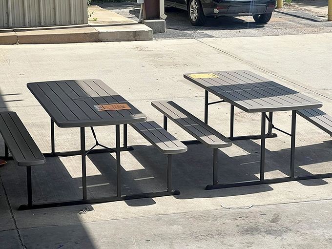 Picnic tables basking in the Oklahoma sun, dreaming of future barbecues and potato salad mishaps.