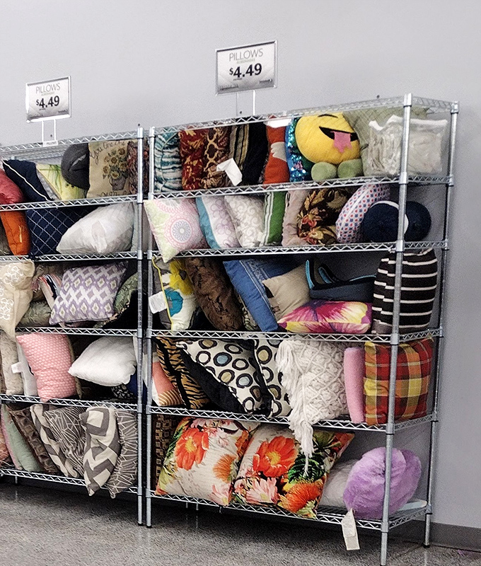 The pillow section: where decorative dreams come true at $4.49. That emoji pillow has seen things in its previous life that would make fascinating dinner conversation.