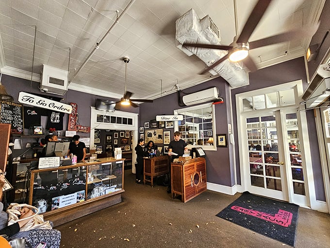 The entrance area doubles as a time capsule and to-go counter, where staff efficiently manage the delicate dance of Southern hospitality and hungry crowds.