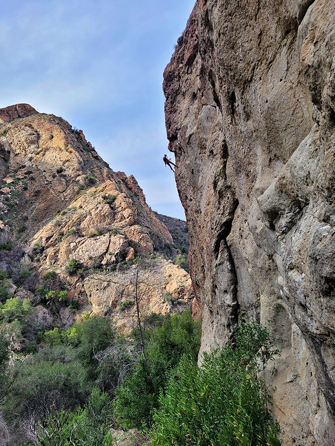 Volcanic rock faces attract climbers who see vertical challenges where sensible people see excellent reasons to stay grounded and horizontal.