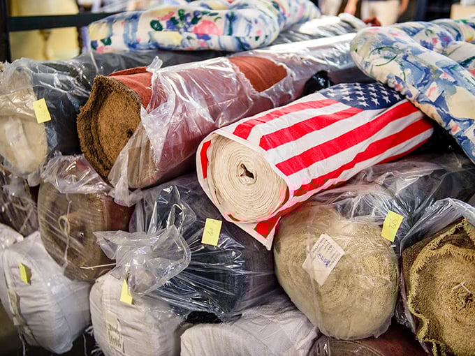 Fabric treasures rolled and stacked like colorful burritos. That American flag textile could become anything from curtains to an upcycled fashion statement.