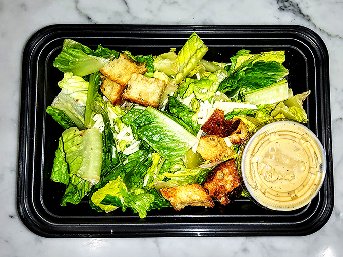 Even Savona's to-go Caesar salad maintains its dignity – crisp romaine, house-made croutons, and dressing that knows its purpose.