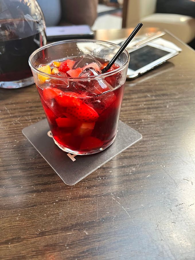 This isn't just sangria; it's summer captured in a glass, with fruit playing hide-and-seek among ice cubes that keep the whole refreshing affair just cool enough.
