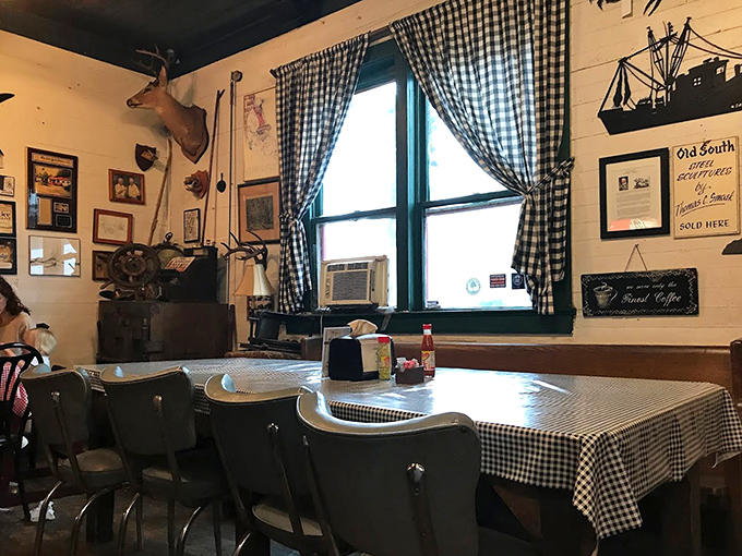 Mounted deer heads watch over diners like guardians of Southern tradition. The checkered tablecloths aren't ironic&mdash;they're authentic.