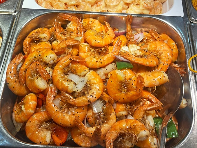 Plump, glistening shrimp that look like they're gossiping with each other in their savory bath. The kind of seafood that makes you forget your manners.