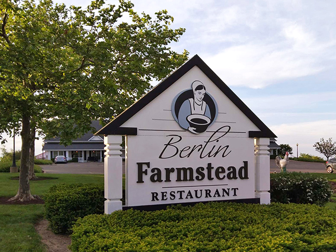 The restaurant's sign stands proud against the landscape, like a beacon guiding hungry travelers to the promised land of homestyle cooking.