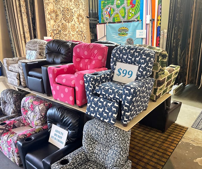 A lineup of recliners and armchairs in various patterns stands ready for adoption, each one promising to become that perfect spot for Sunday afternoon naps.
