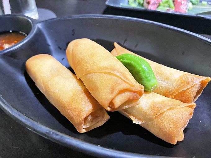 Spring rolls standing at attention, ready to shatter into crispy submission with that first satisfying crunch.