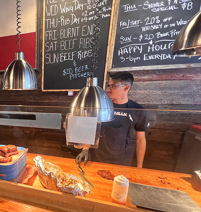 Behind every great barbecue is someone with smoke-stained hands and the patience of a saint.