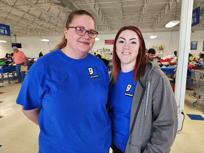 The unsung heroes of the Goodwill experience &ndash; staff members who transform chaos into opportunity. Their blue shirts are beacons in a sea of merchandise.
