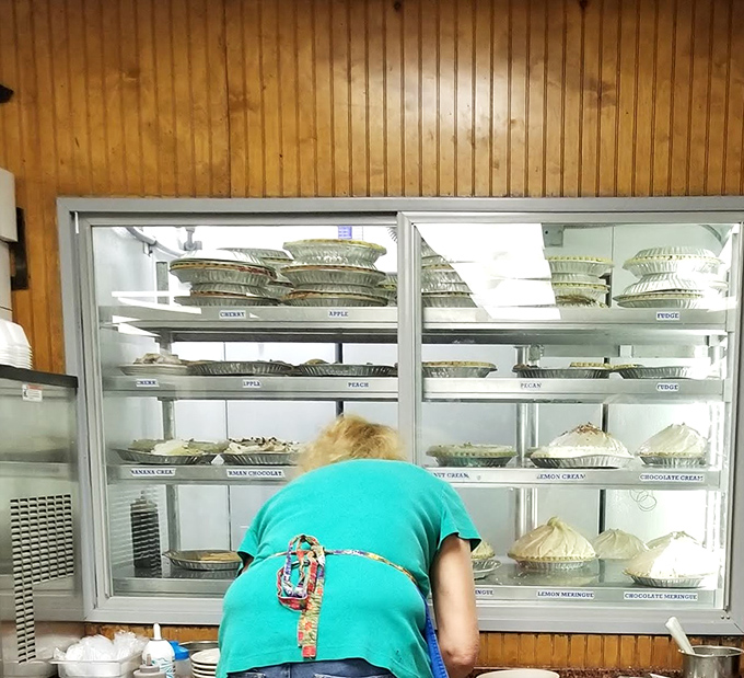 Behind every great pie is a dedicated baker. The display case is a museum of edible art where meringue peaks reach toward the heavens.