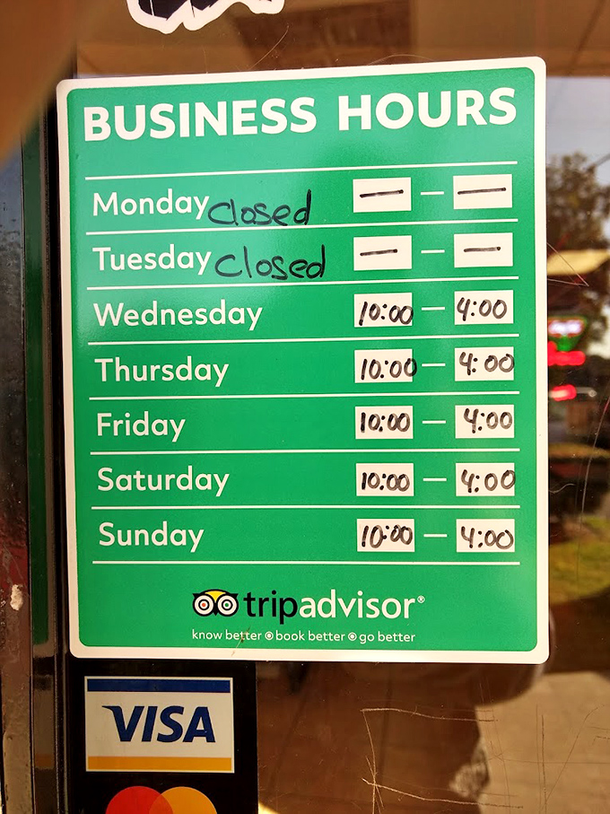 The hours sign tells you everything: closed Mondays and Tuesdays because perfection requires rest. Plan accordingly or face the consequences.