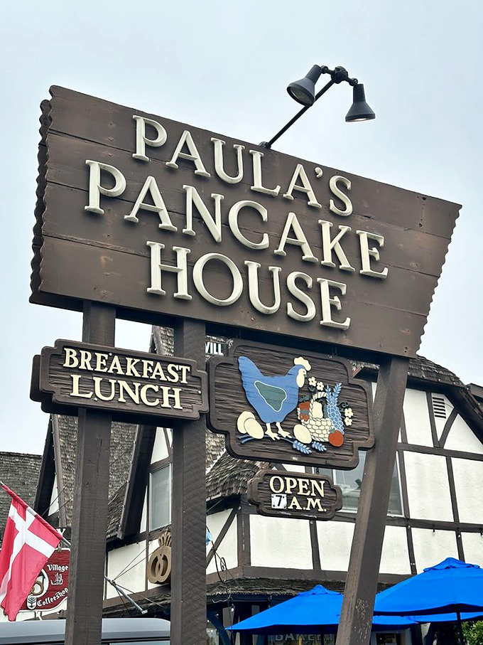 That wooden sign isn't just announcing a restaurant—it's promising a portal to a European breakfast experience without the transatlantic flight.