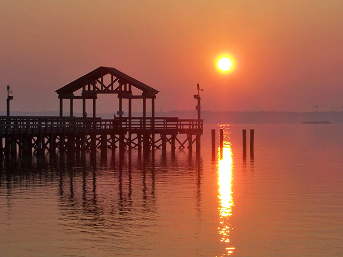 That magical moment when the sun kisses the fishing pier goodnight. Worth setting your alarm for, even if you're not a morning person.