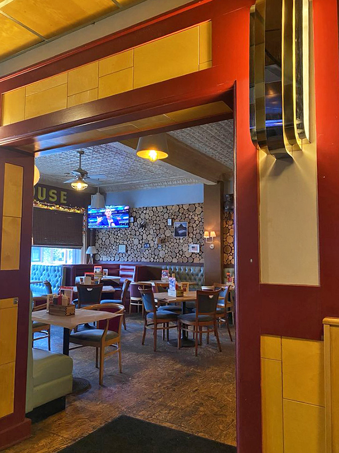 Warm woods, rich reds, and golden lighting create the perfect stage for barbecue drama to unfold. The tin ceiling has witnessed countless "first bite" faces.