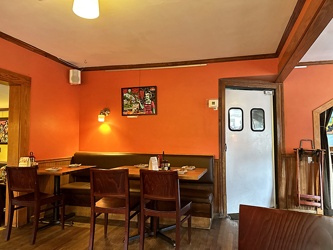 Coral walls and wooden accents create dining nooks that feel like you're in on Austin's best-kept secret.