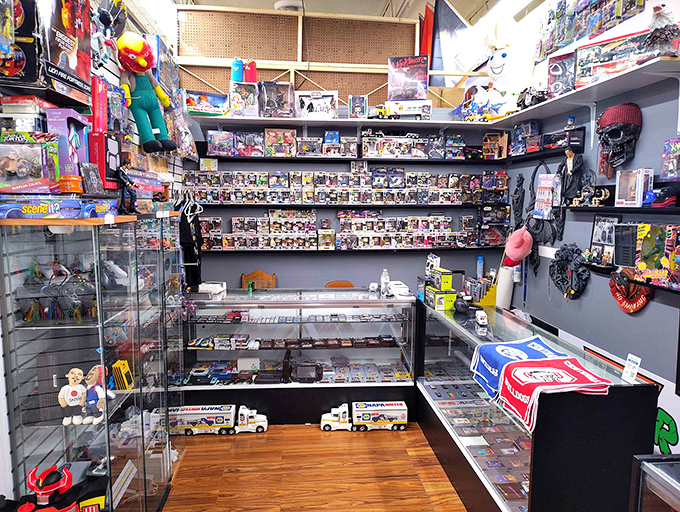 Action figure diplomacy in progress—where Ghostbusters, superheroes, and collectible vehicles negotiate shelf space in peaceful coexistence.