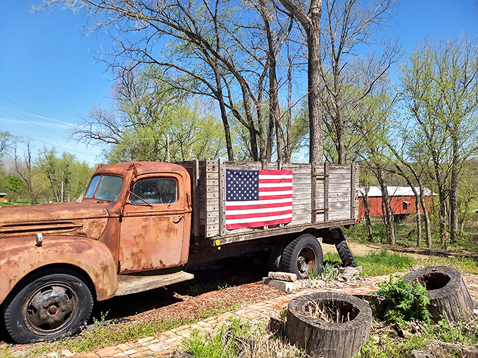 That vintage truck has seen better days, but it's earned its retirement spot near this historic beauty.