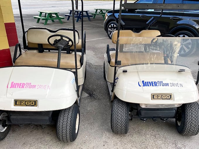 The humble golf carts&mdash;unsung heroes of the drive-in experience&mdash;ready to guide latecomers to the perfect viewing spot.