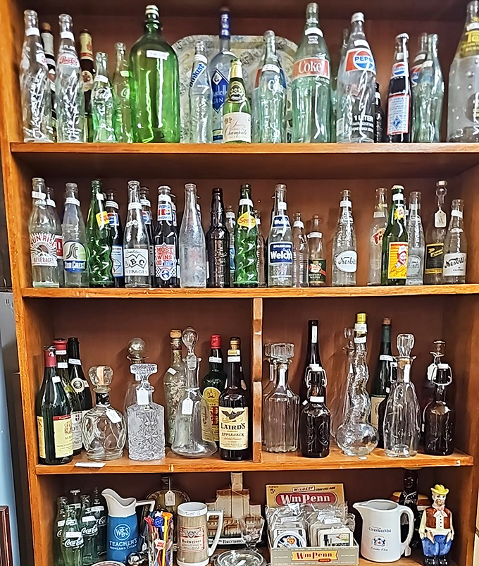 The bottle collection that would make any vintage soda enthusiast weak at the knees. That green glass catches light in ways plastic never will.