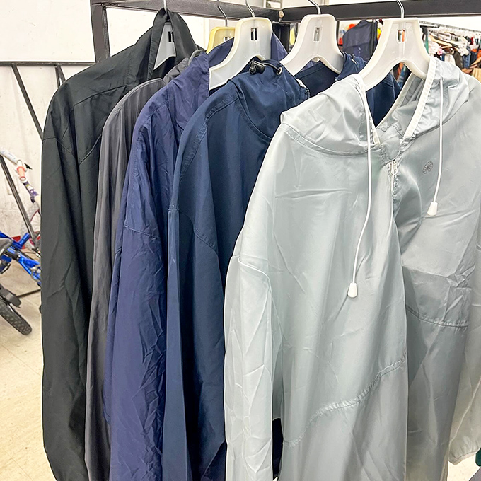 A rainbow of windbreakers stands at attention, ready for their next adventure. These lightweight warriors have weathered storms and are ready for more.