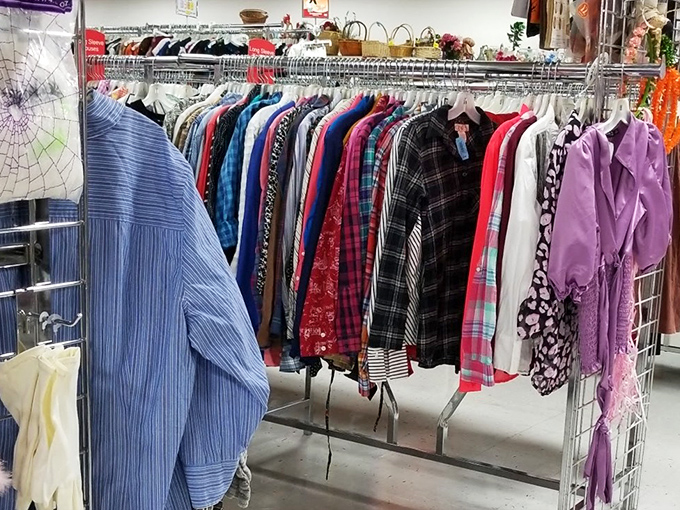 A rainbow of possibilities hangs in perfect formation, each garment whispering, "Take me home, I'll make you look fabulous for less!"