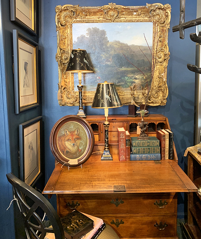 A secretary desk that's probably held more secrets than the CIA, paired with lamps that have illuminated centuries of handwritten letters.