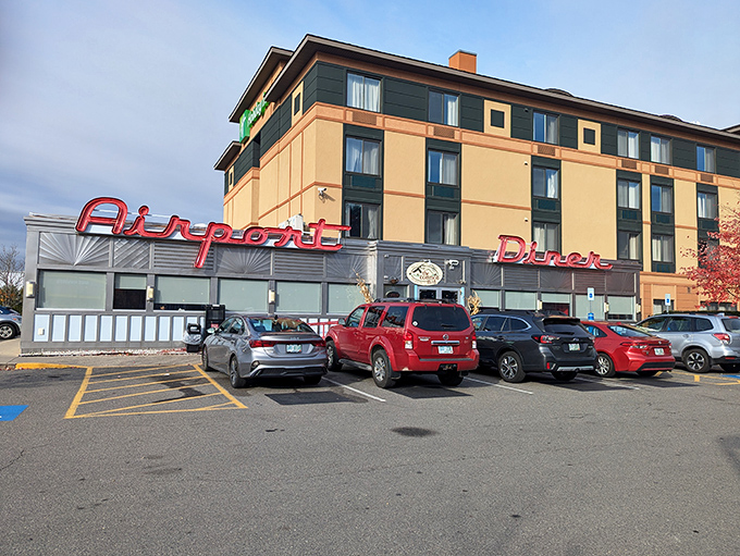 The Airport Diner's sleek silver exterior and bold red signage promise a first-class meal without the first-class price.