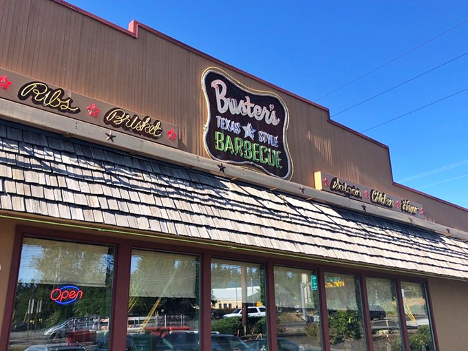Buster's vintage-style sign promises authentic Texas BBQ in Oregon. The lasso border and star hint at Lone Star State flavors inside.