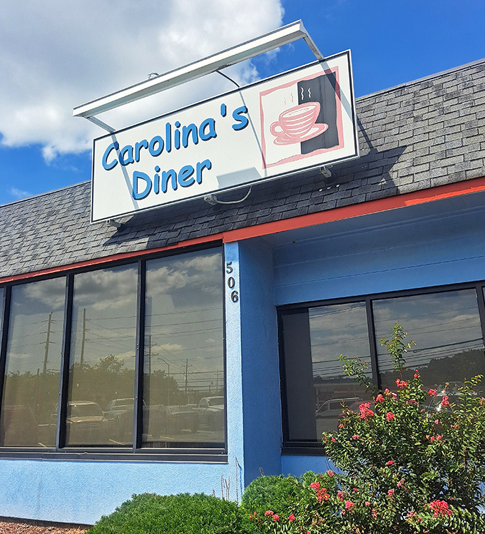 Carolina's Diner's cheerful blue exterior and classic sign are like a beacon for breakfast lovers. Follow the coffee aroma!