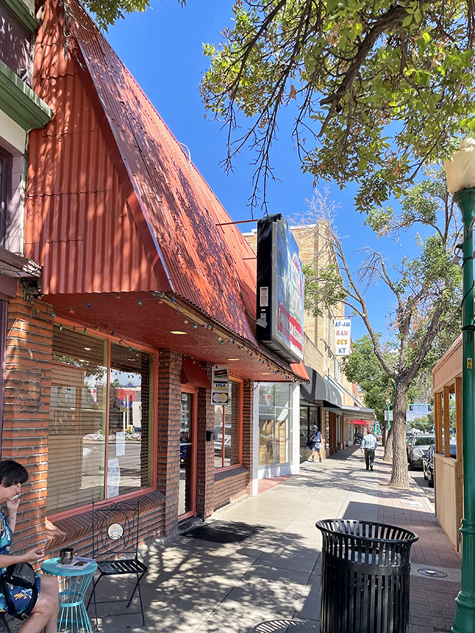 Tree-shaded sidewalks lead past local shops where browsing costs nothing and buying costs surprisingly little.