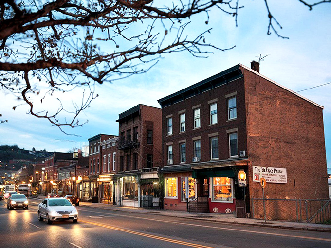 Evening lights glow warm along storefronts where shopping feels like visiting old friends who treat you right.