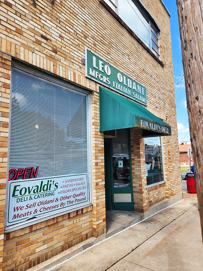 Traditional green awnings signal serious Italian sandwich craft happening behind these weathered brick walls.