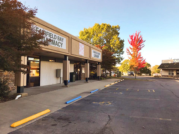 Autumn colors explode around small-town shops where pharmacy and laundromat sit side-by-side serving this peaceful hilltop community daily.