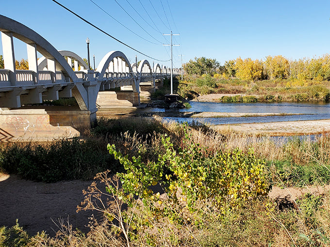 Riverside tranquility flows through town where morning walks cost nothing but deliver priceless peace and serenity.
