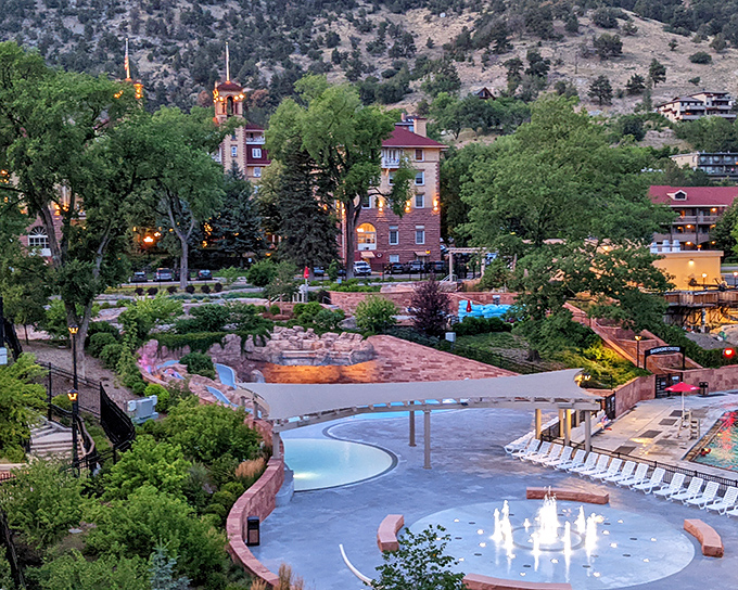 As evening settles over the mountains, Glenwood Springs glows with the charm of its historic hotel and peaceful hillside setting.