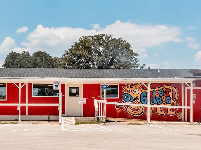 Goldee's bright red exterior with its playful cow mural signals this isn't your grandpa's BBQ joint. Fresh faces keeping traditions alive.