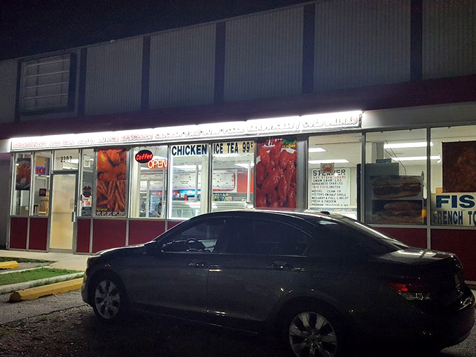 Happy Times' illuminated storefront glows like a beacon in the night, guiding seafood pilgrims to flavor salvation.