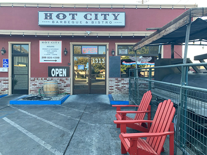 Hot City's rustic red building with welcoming porch chairs says, "Slow down and stay awhile."