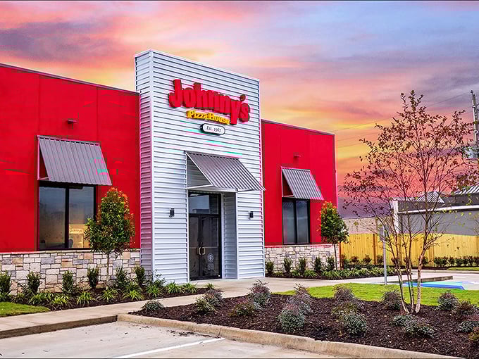 Johnny's modern red and white building stands like a beacon of hope for the pizza-deprived souls of Monroe.