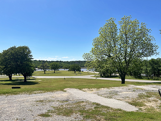 Expansive lake views stretch toward distant shores, making every picnic feel like waterfront dining luxury.