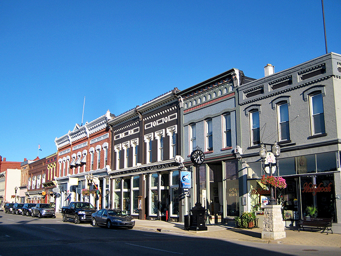 Manistee's Victorian storefronts stand like well-preserved time capsules where your wallet can actually relax and enjoy the view.