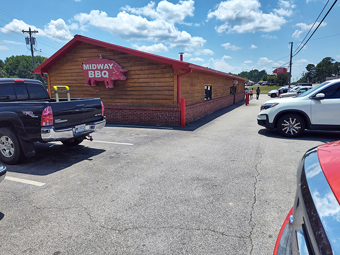 That hanging red pig sign at Midway BBQ isn't just cute &ndash; it's a landmark guiding hungry travelers home since 1941.