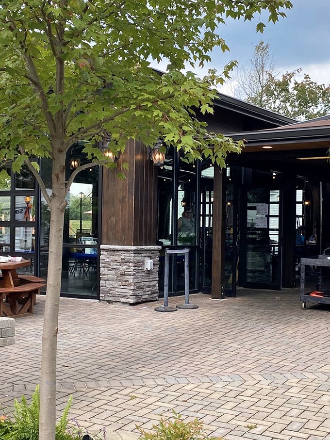 Mike Linnig's modern exterior welcomes families to a riverside tradition where seafood and outdoor dining create lasting memories.